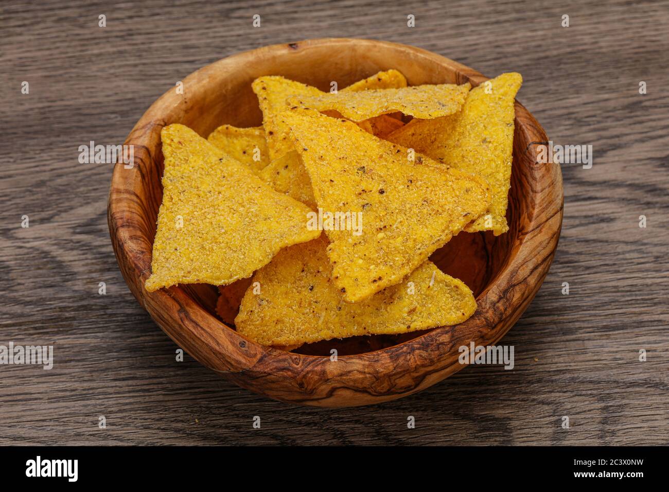 Mexican crunchy corn nachos triangle heap Stock Photo - Alamy