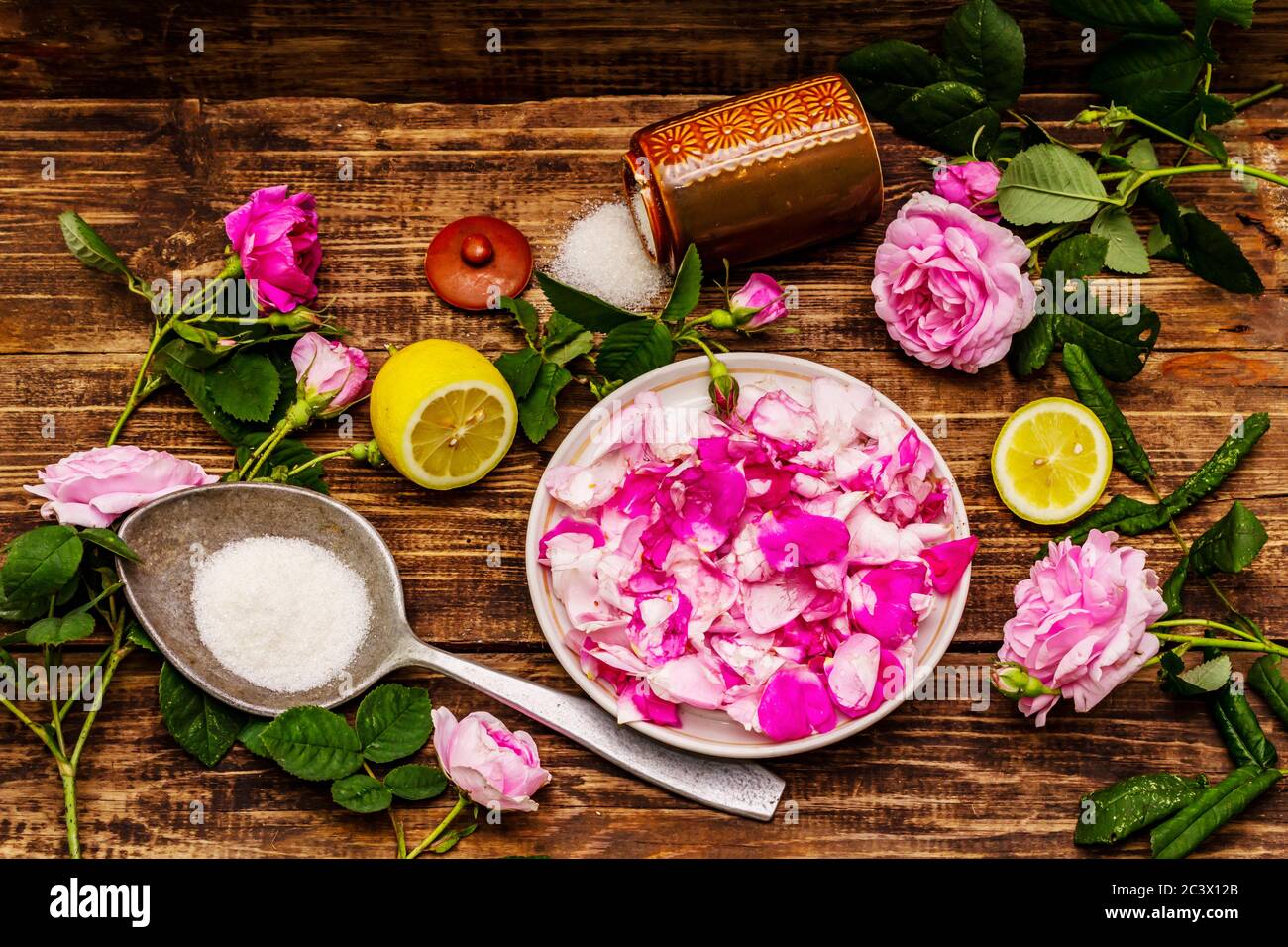 Ingredients for cooking rose petals jam. Sugar, lemon, fragrant flowers ...