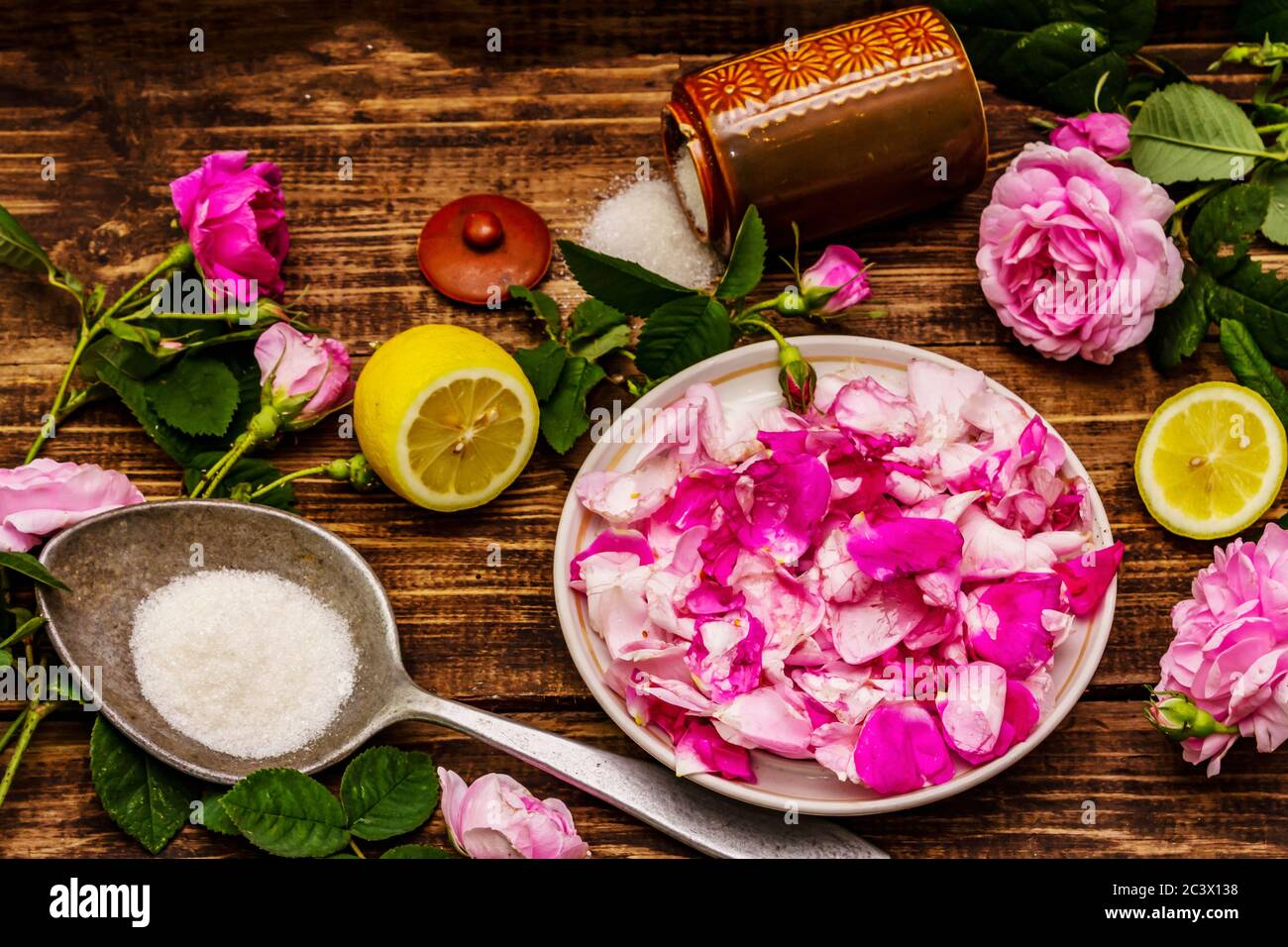 Ingredients for cooking rose petals jam. Sugar, lemon, fragrant flowers ...