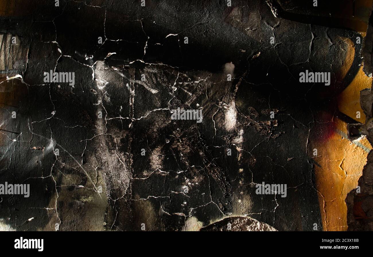 Old burned wall with peeling paint Stock Photo - Alamy