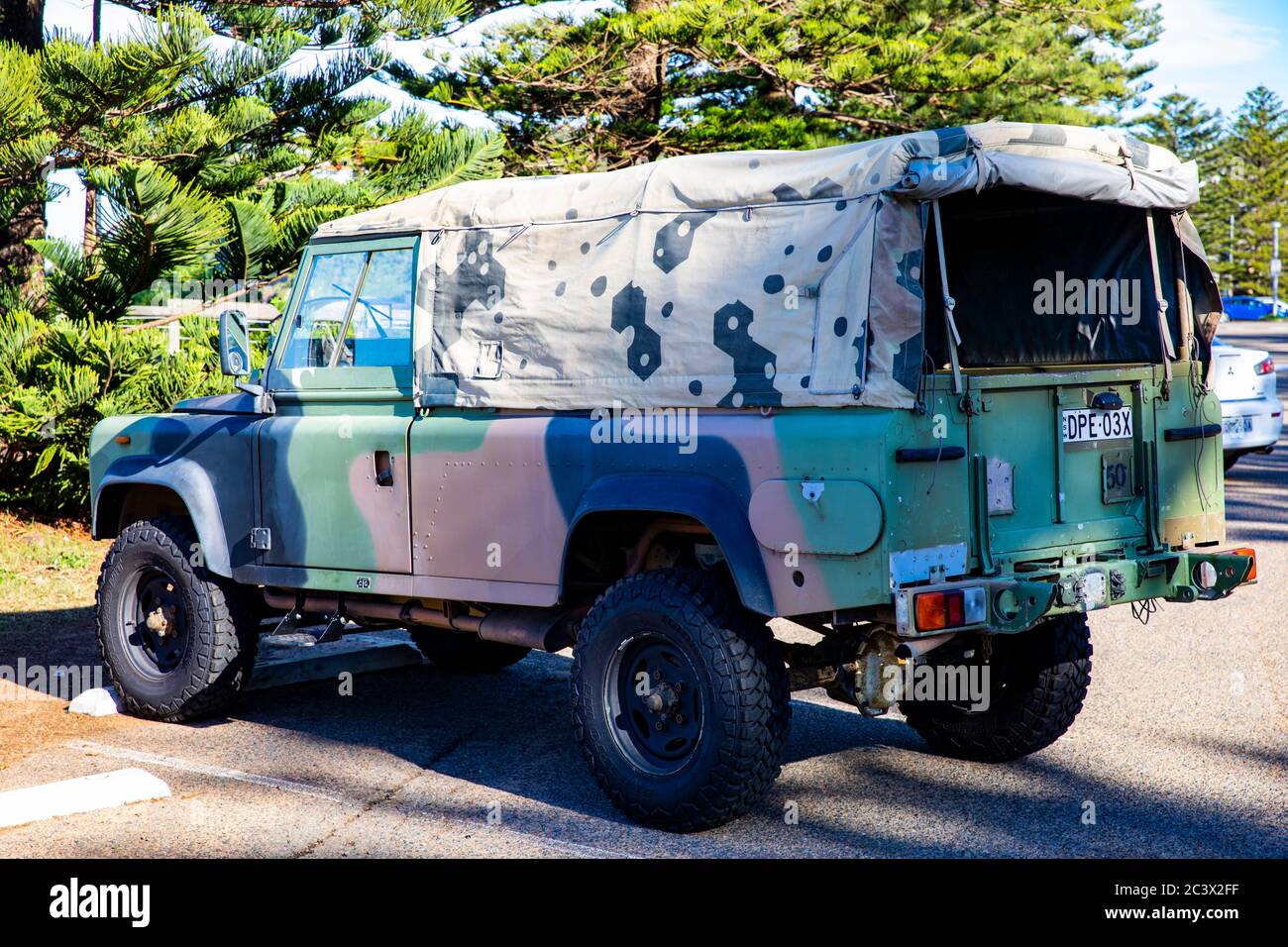 Land Rover defender soft top in camouflage in Sydney,Australia Stock ...