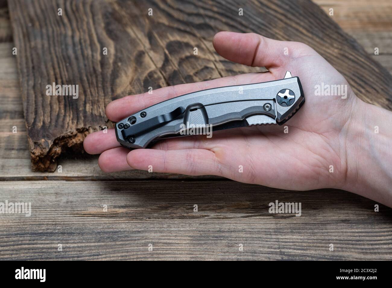 A knife placed in the palm of your hand. The knife is folded. Pocket ...