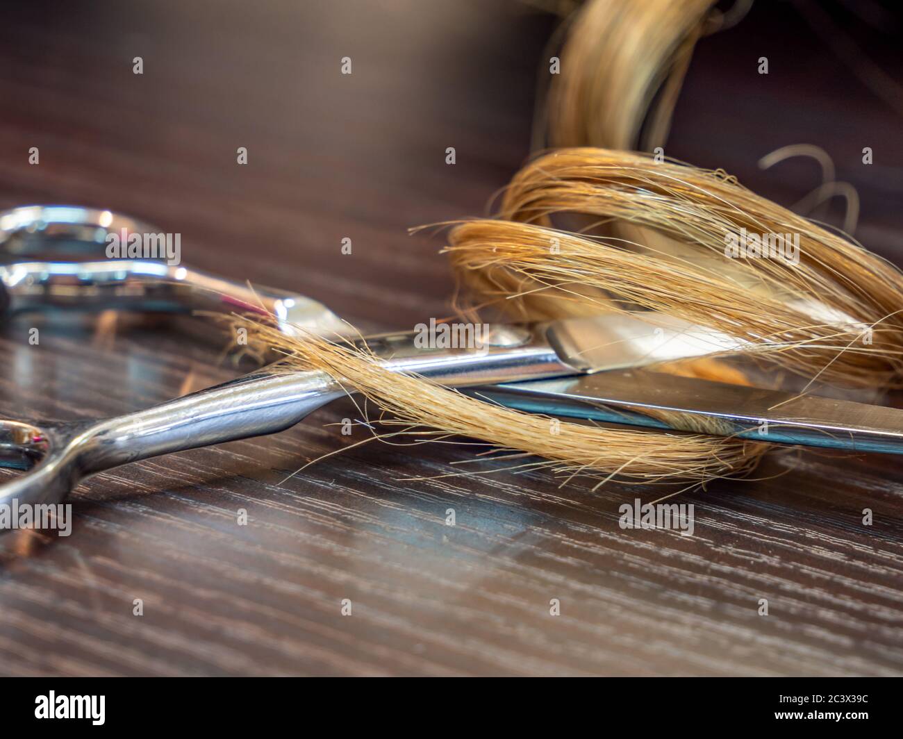 Scissors and curl background hairdressing craft Stock Photo - Alamy