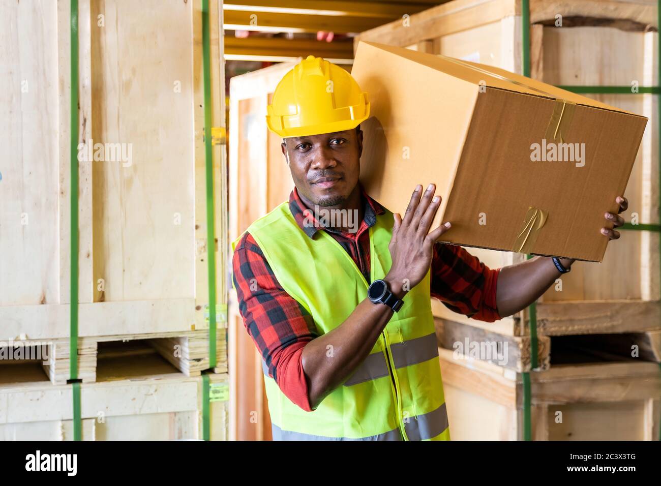 Portrait of african black warehouse worker hold cardboard box packaging ...