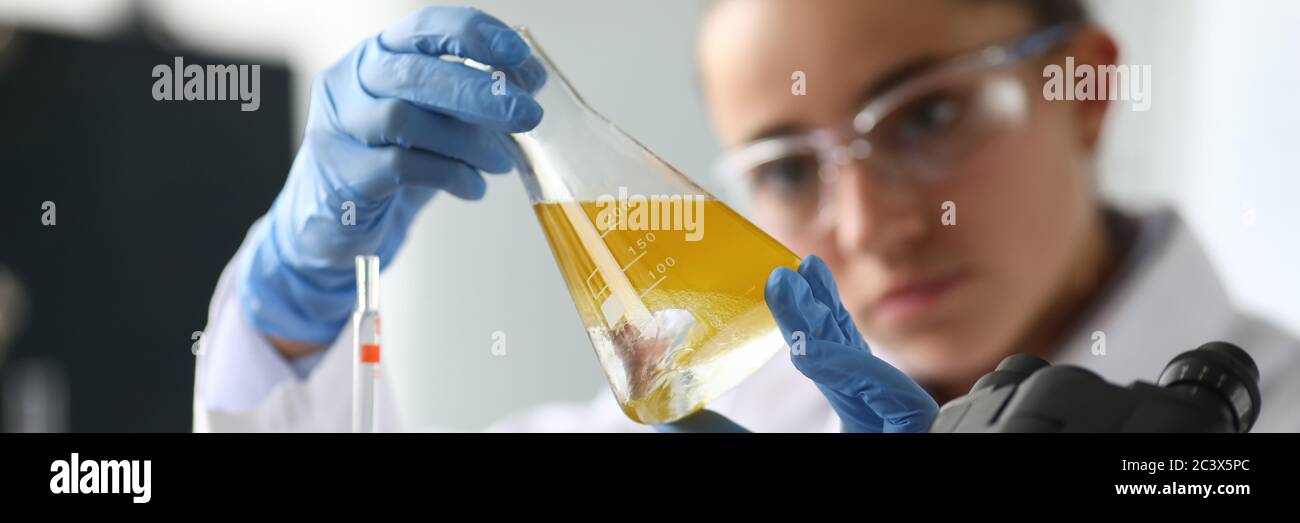 Scientist making experiments with mixture Stock Photo - Alamy