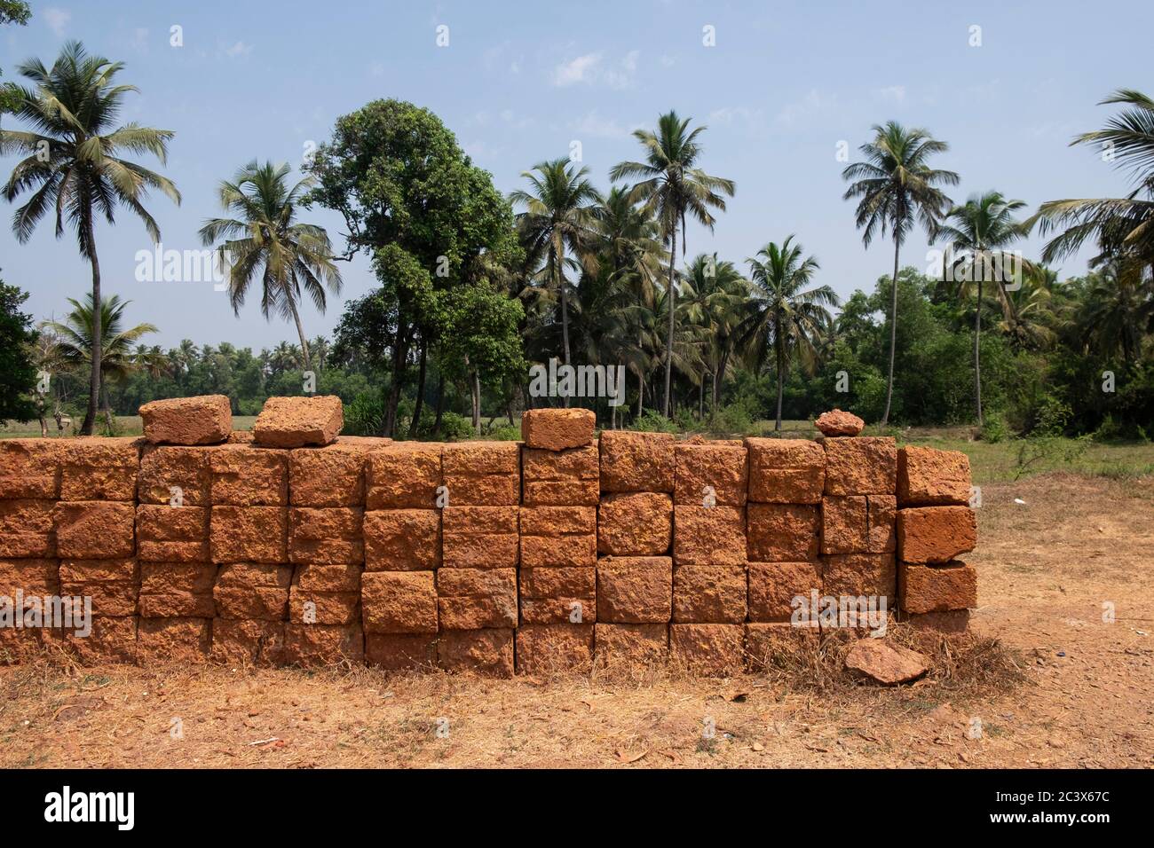 Stack of clay bricks in Goa, India Stock Photo - Alamy