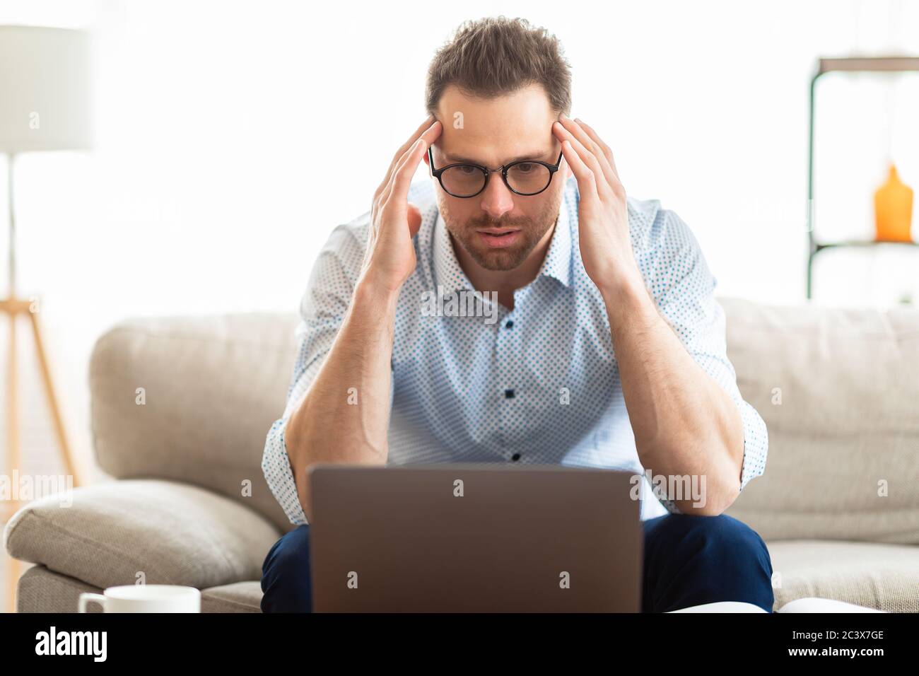 Shocked american manager using his personal computer Stock Photo - Alamy