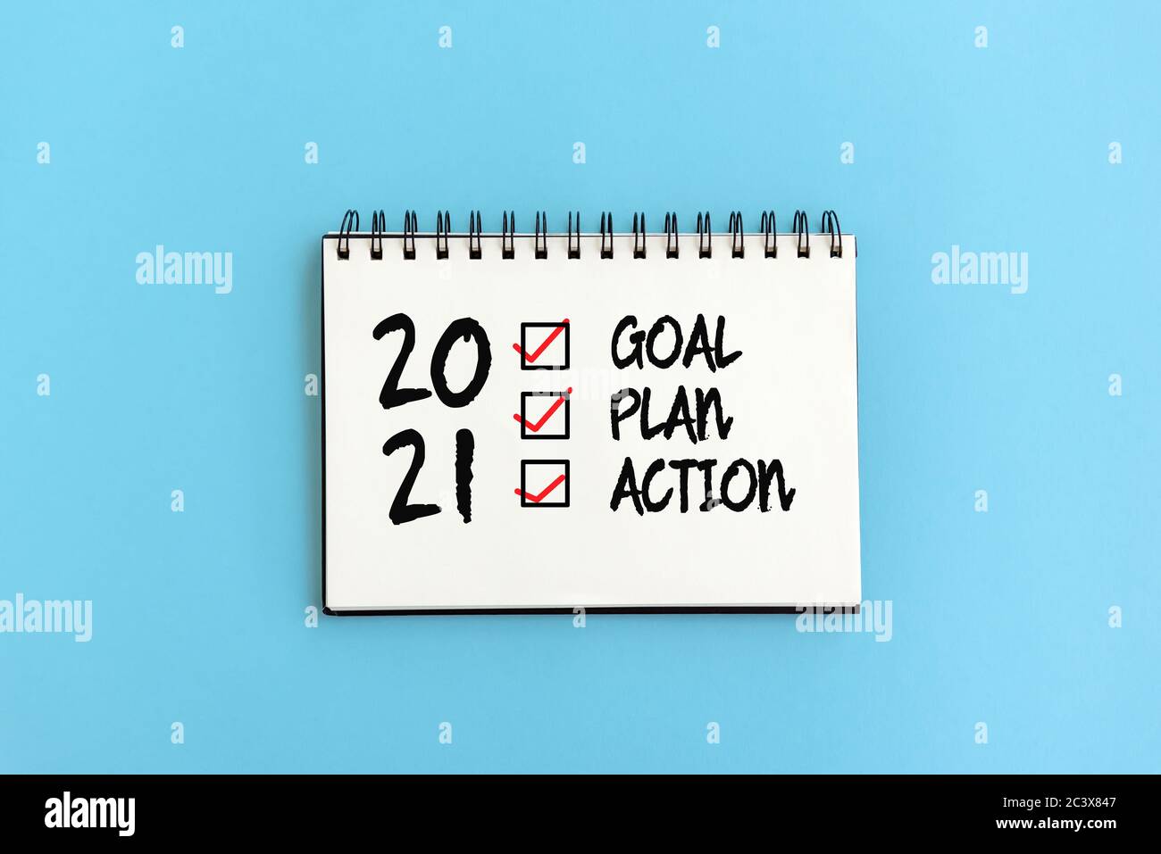 2021 goal, plan, action checklist text text on note pad blue background ...