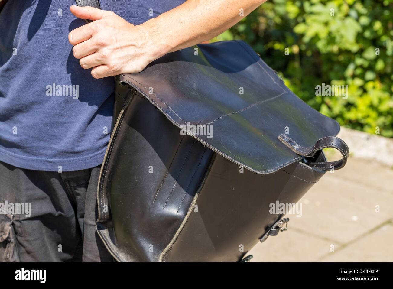 Postman delivering parcels, Bag of a postal worker, Full of letters ...
