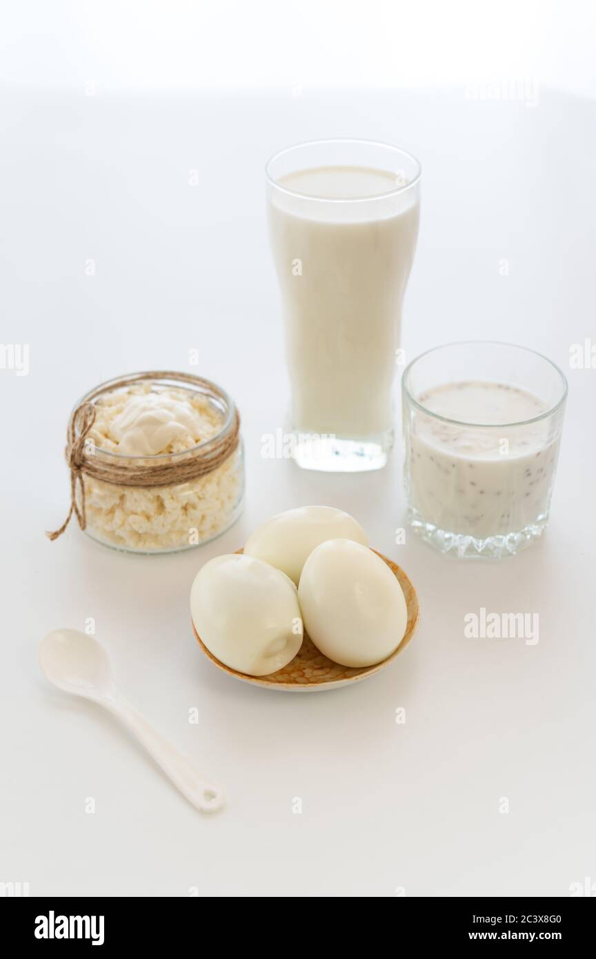 Homemade dairy products on a white background. Breakfast with boiled ...