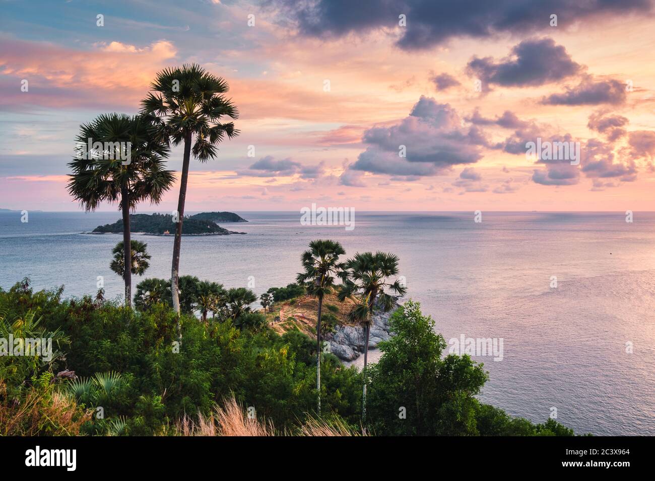 Viewpoint Laem Promthep cape with colorful sky and sugar palm tree in ...