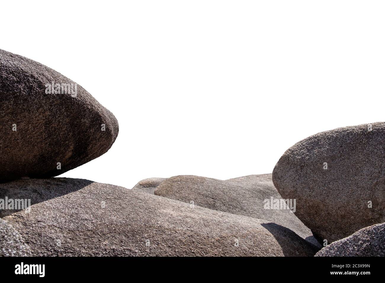 Large round rough stones stacked on white background Stock Photo - Alamy