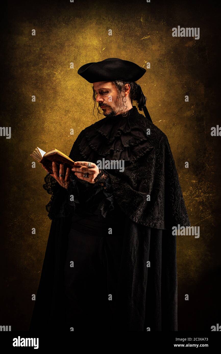 Priest writing in a book hi-res stock photography and images - Alamy