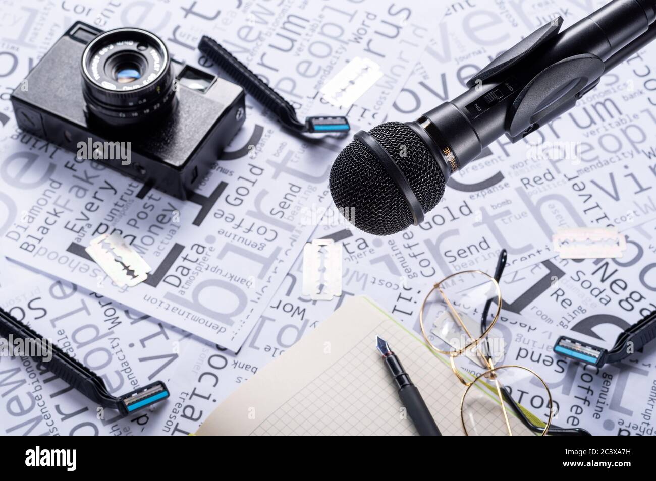Writer's desk. The desk of a journalist. Microphone, notebook and ...