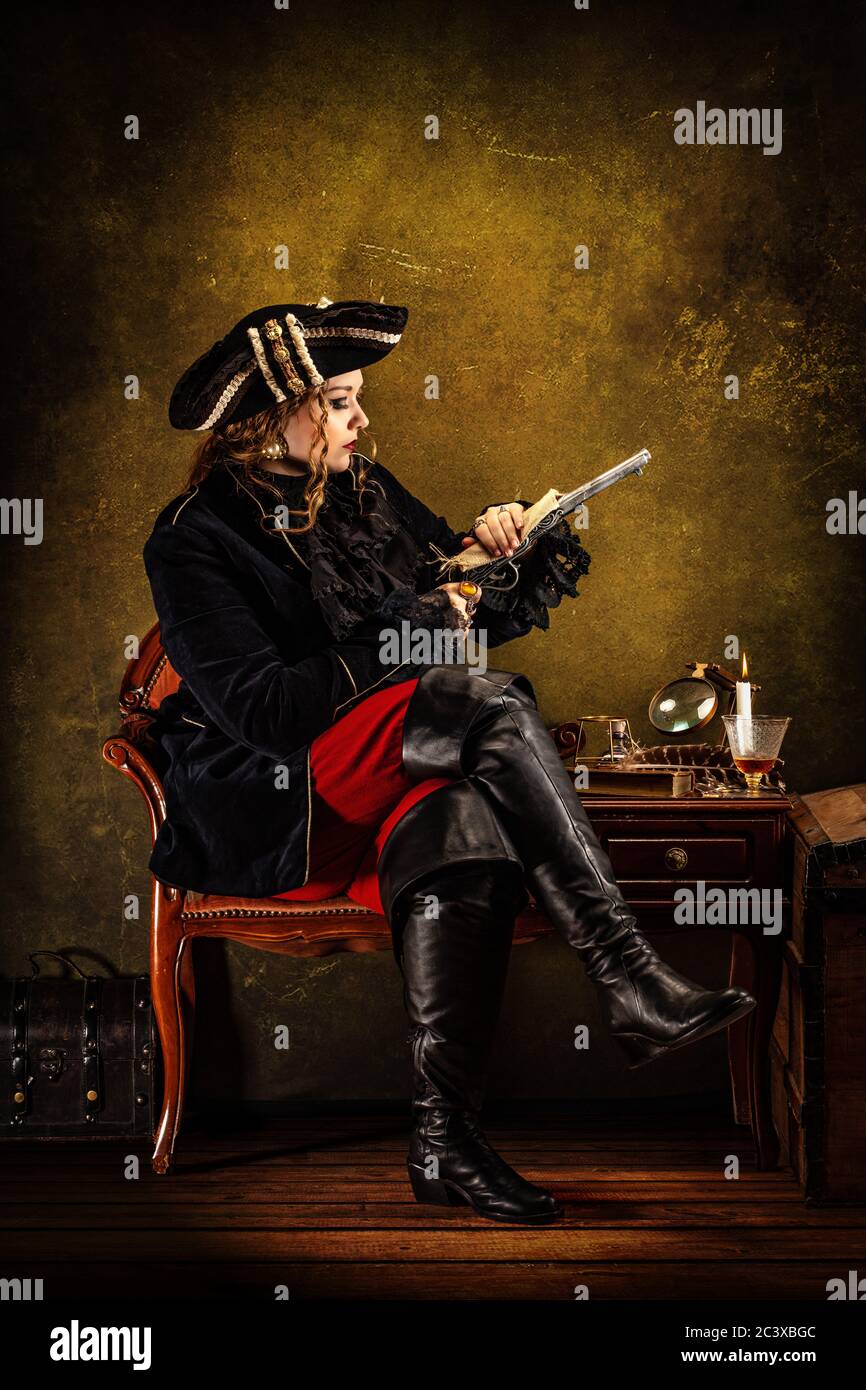 Portrait of a privateer cleaning his musket gun, sitting in his cabin ...