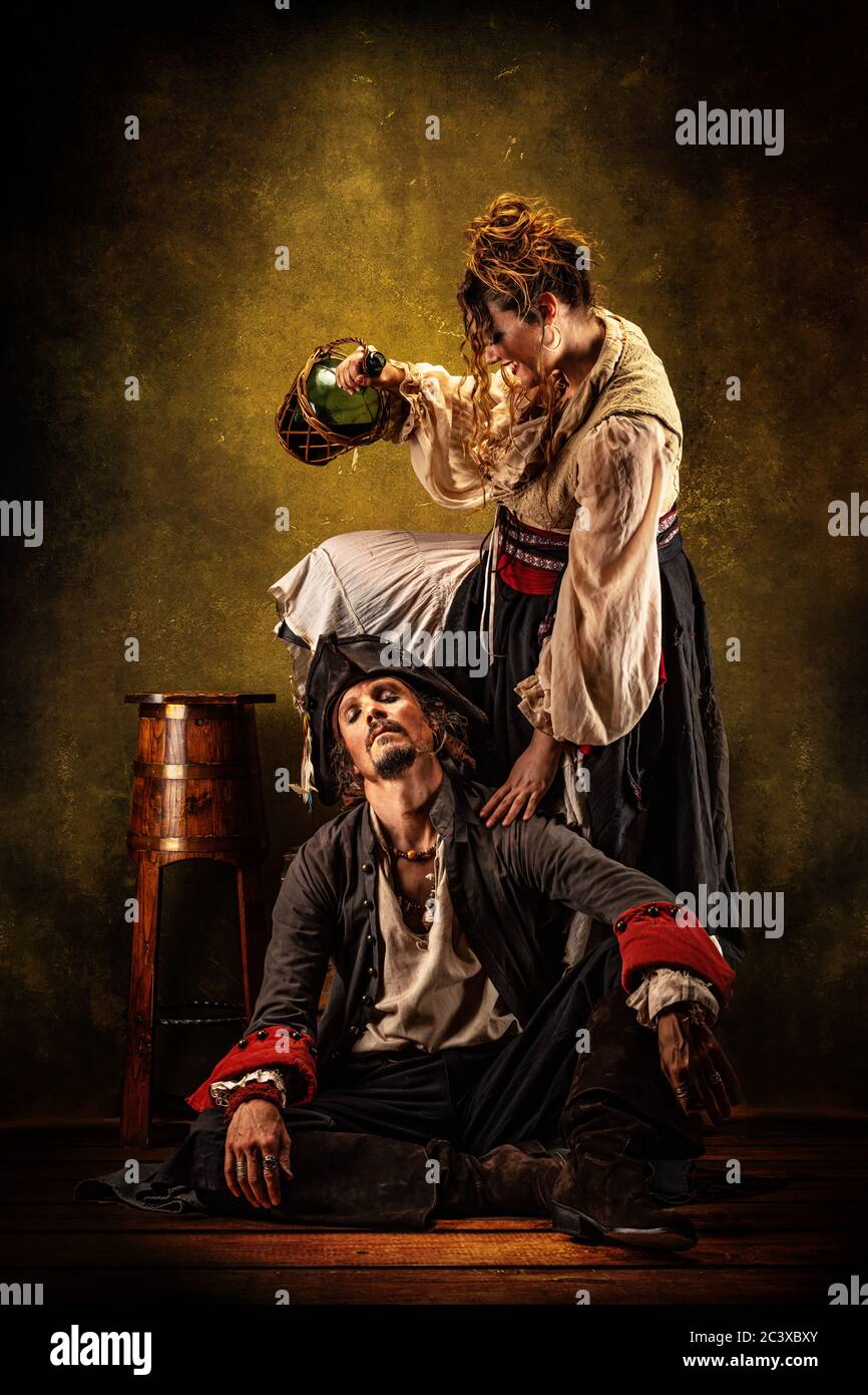 Portrait of a couple of pirates drinking rum in a tavern Stock Photo ...
