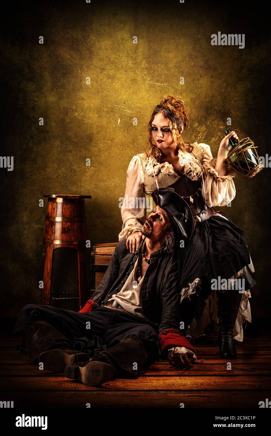 Portrait of a couple of pirates drinking rum in a tavern Stock Photo ...