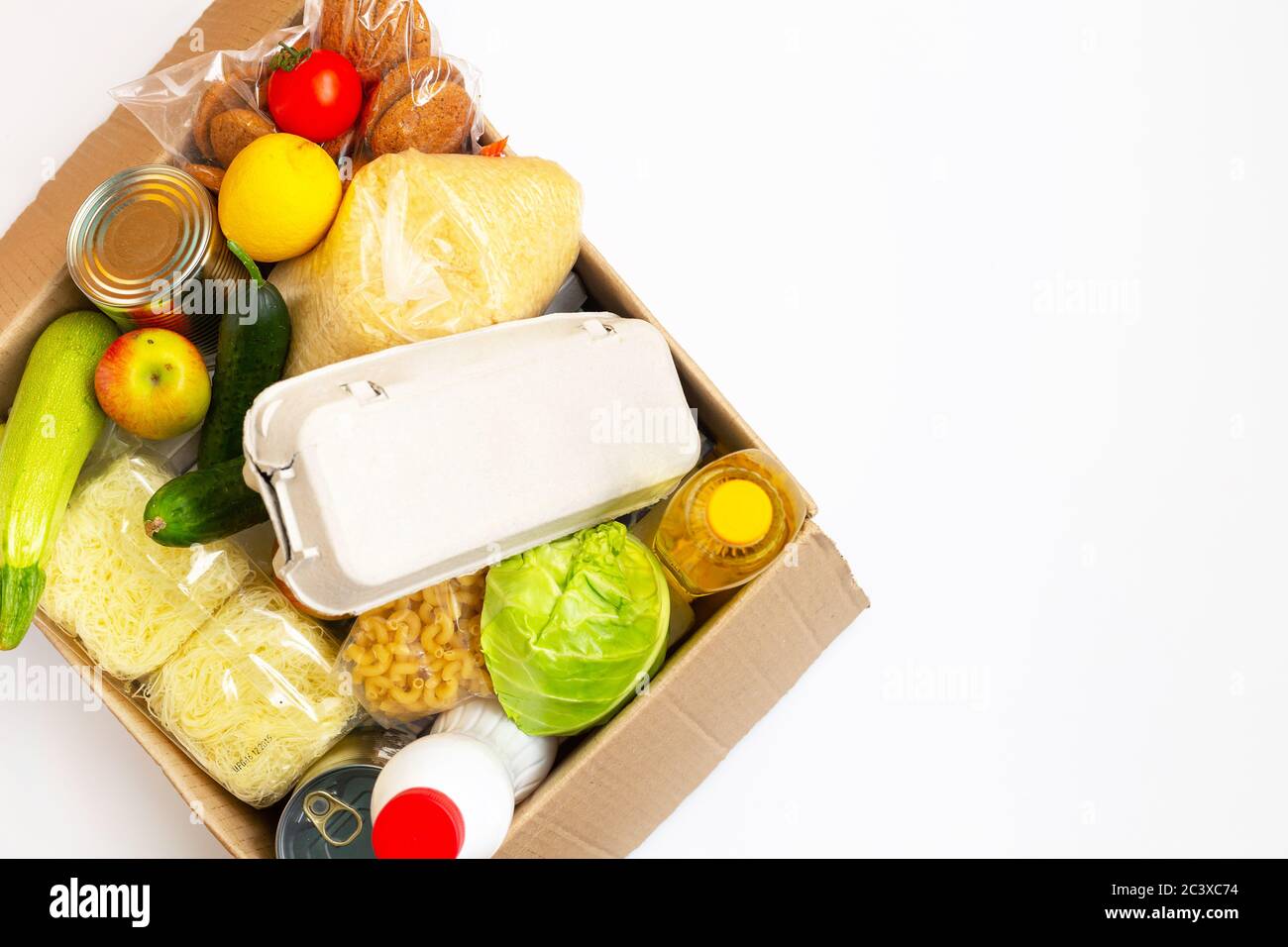 Food donations or food delivery concept in a cardboard box Stock Photo ...