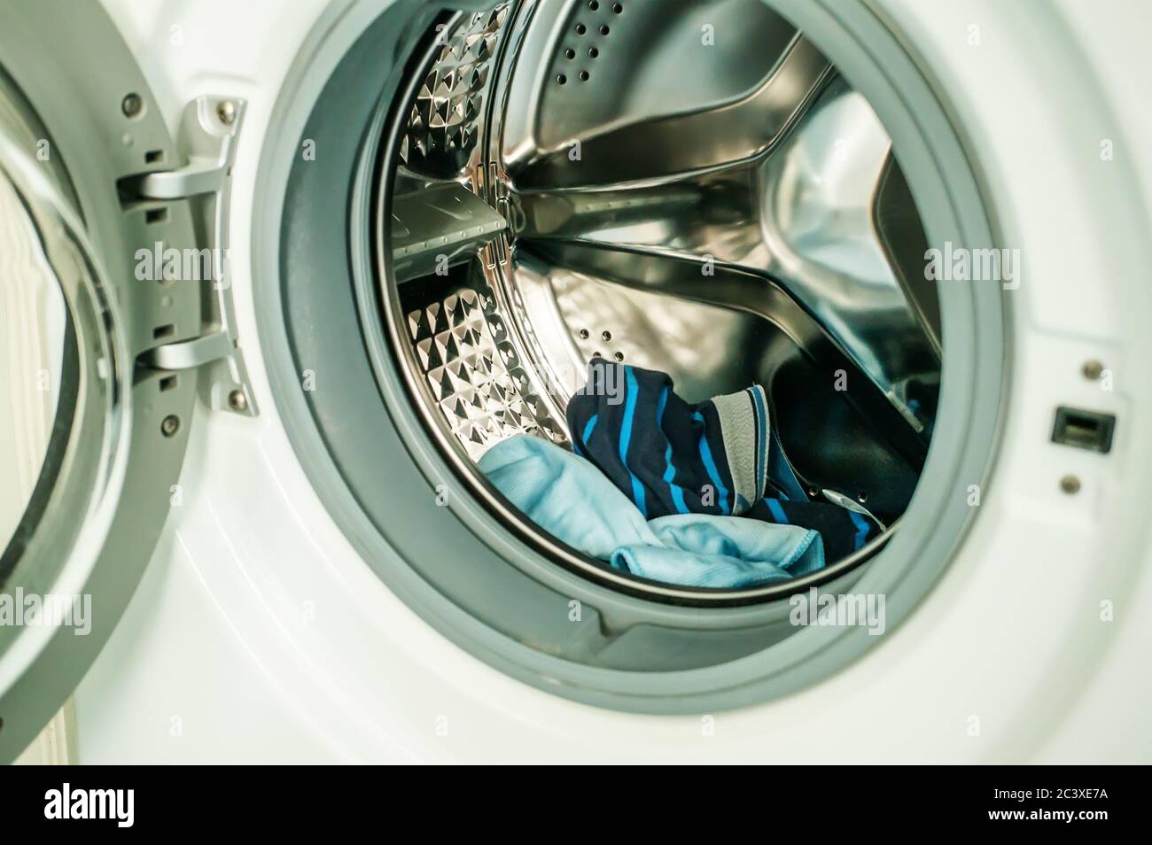 Open washing machine drum close-up. washing machine is ready to load ...