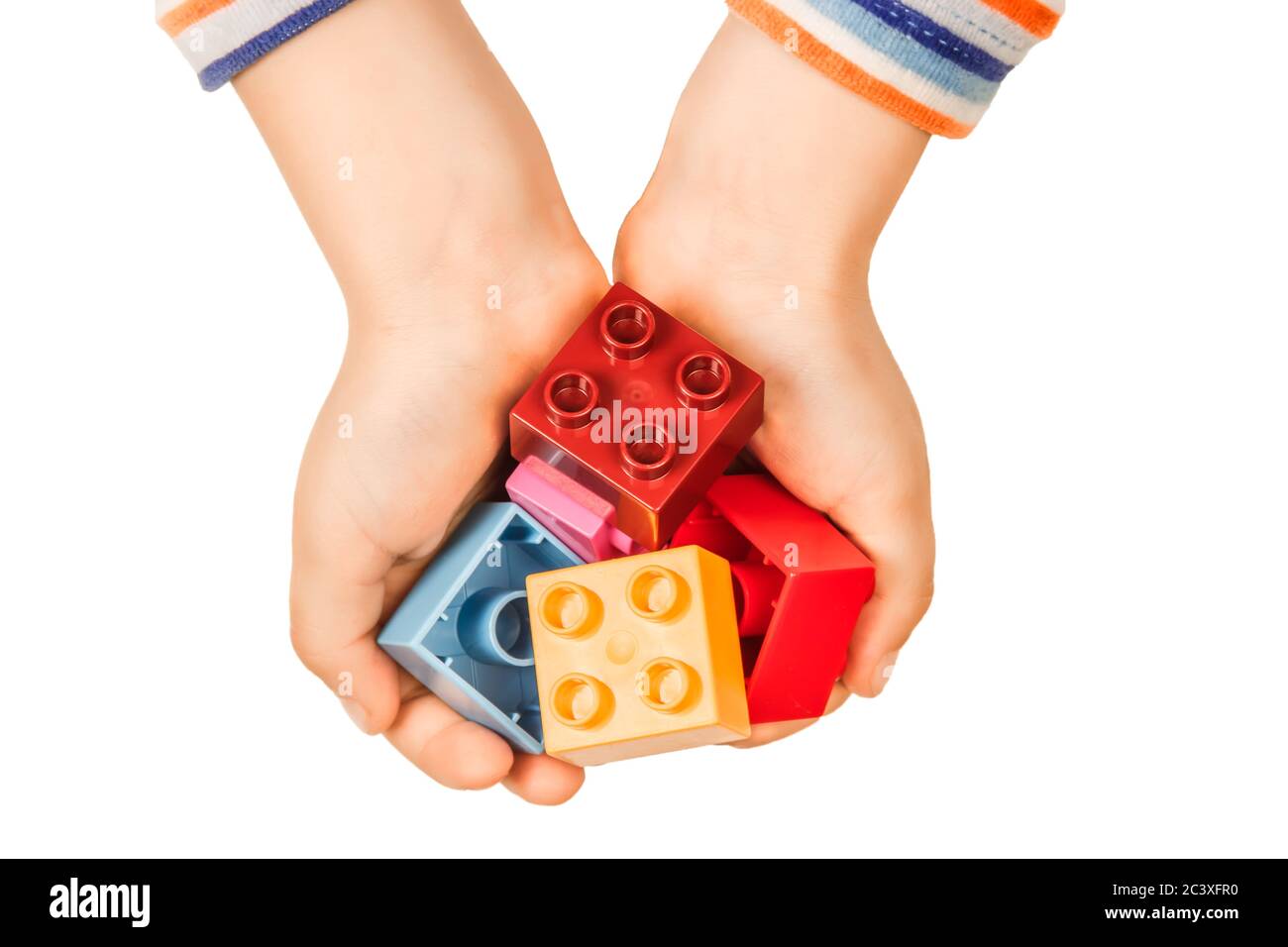 Children's hands hold parts of Lego Stock Photo - Alamy