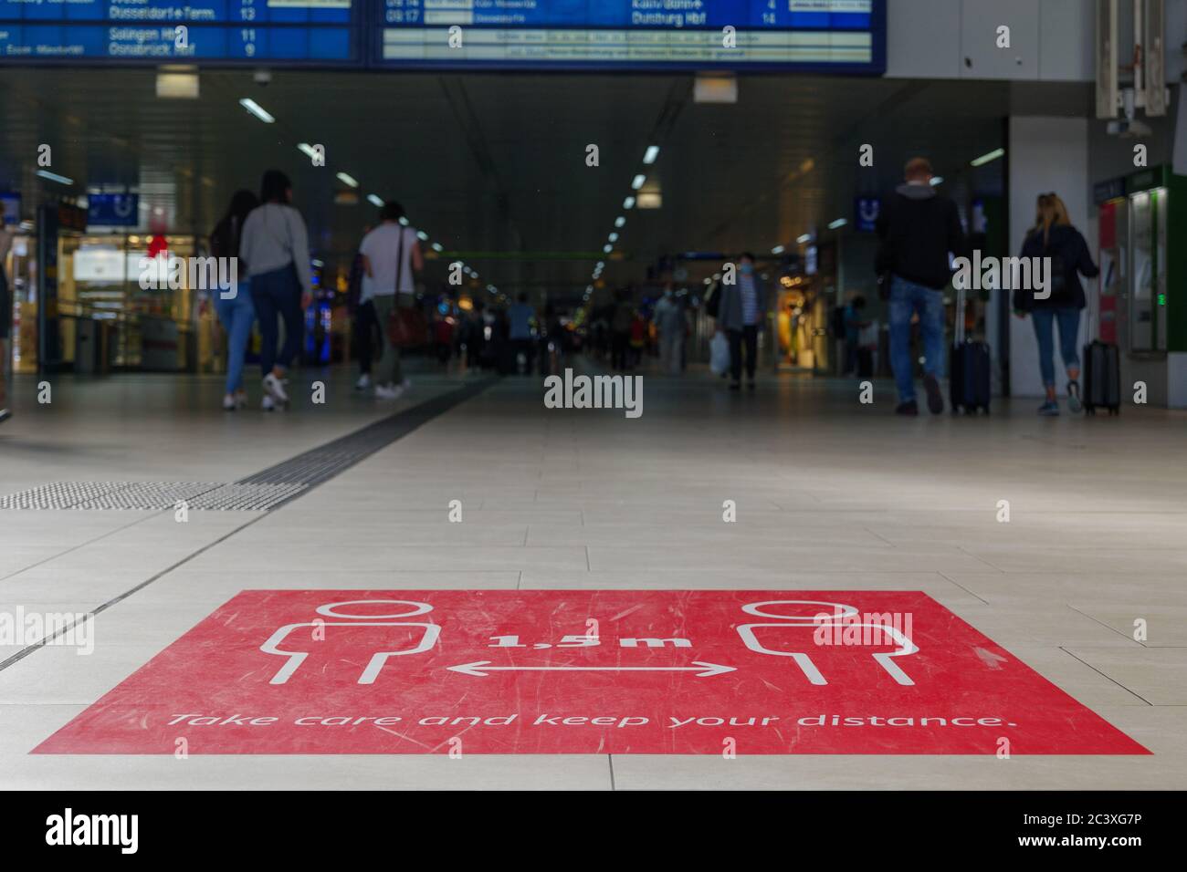 " Keep your distance", on red rectangular caution sign on the floor ...