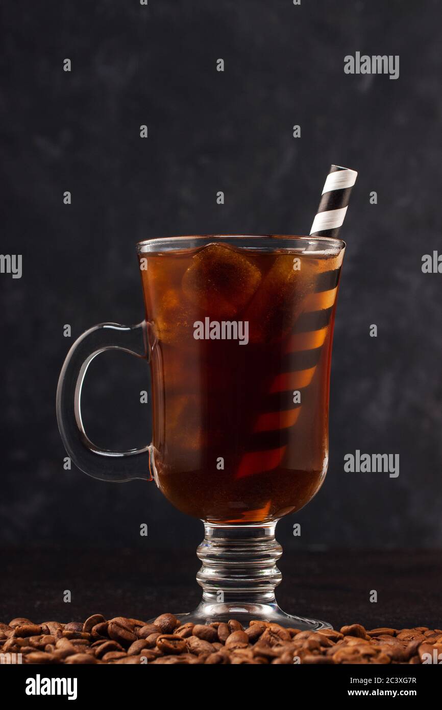 Coffee cold brewing with ice in a glass and with a straw Stock Photo ...