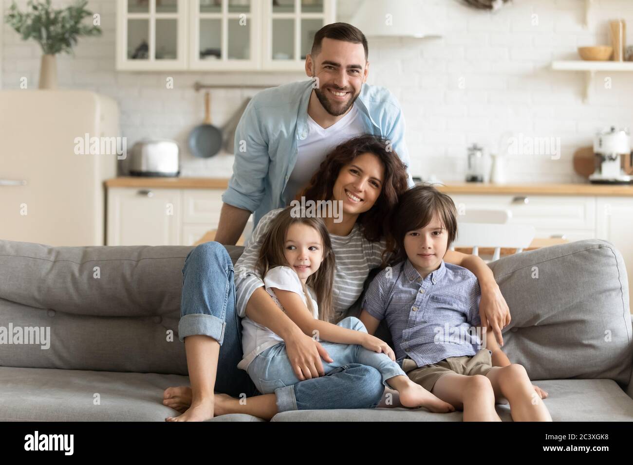 Close up portrait picture of happy young family of four people Stock ...