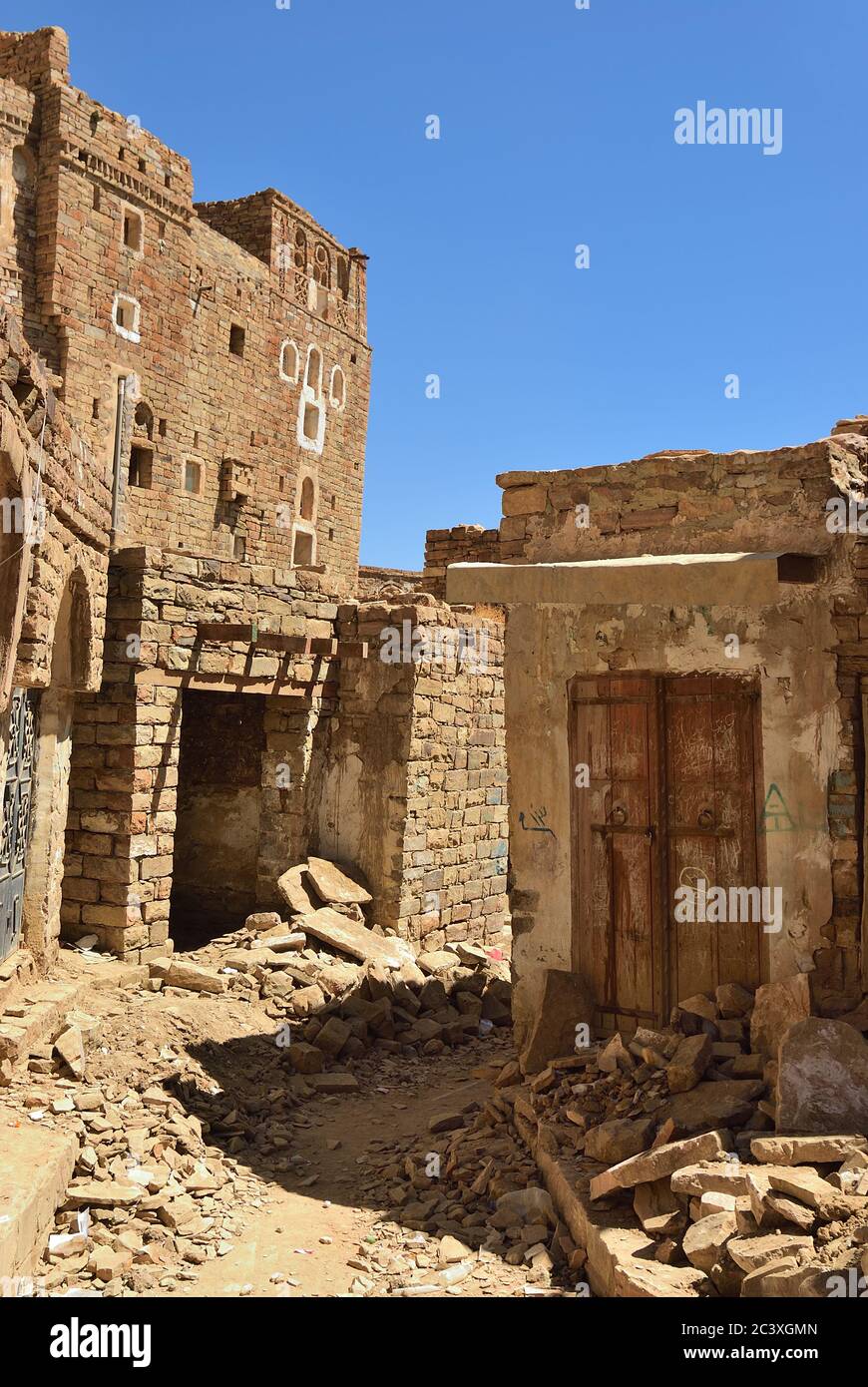 Destroyed houses in the medieval village of Thula. Yemen. Thula is a ...