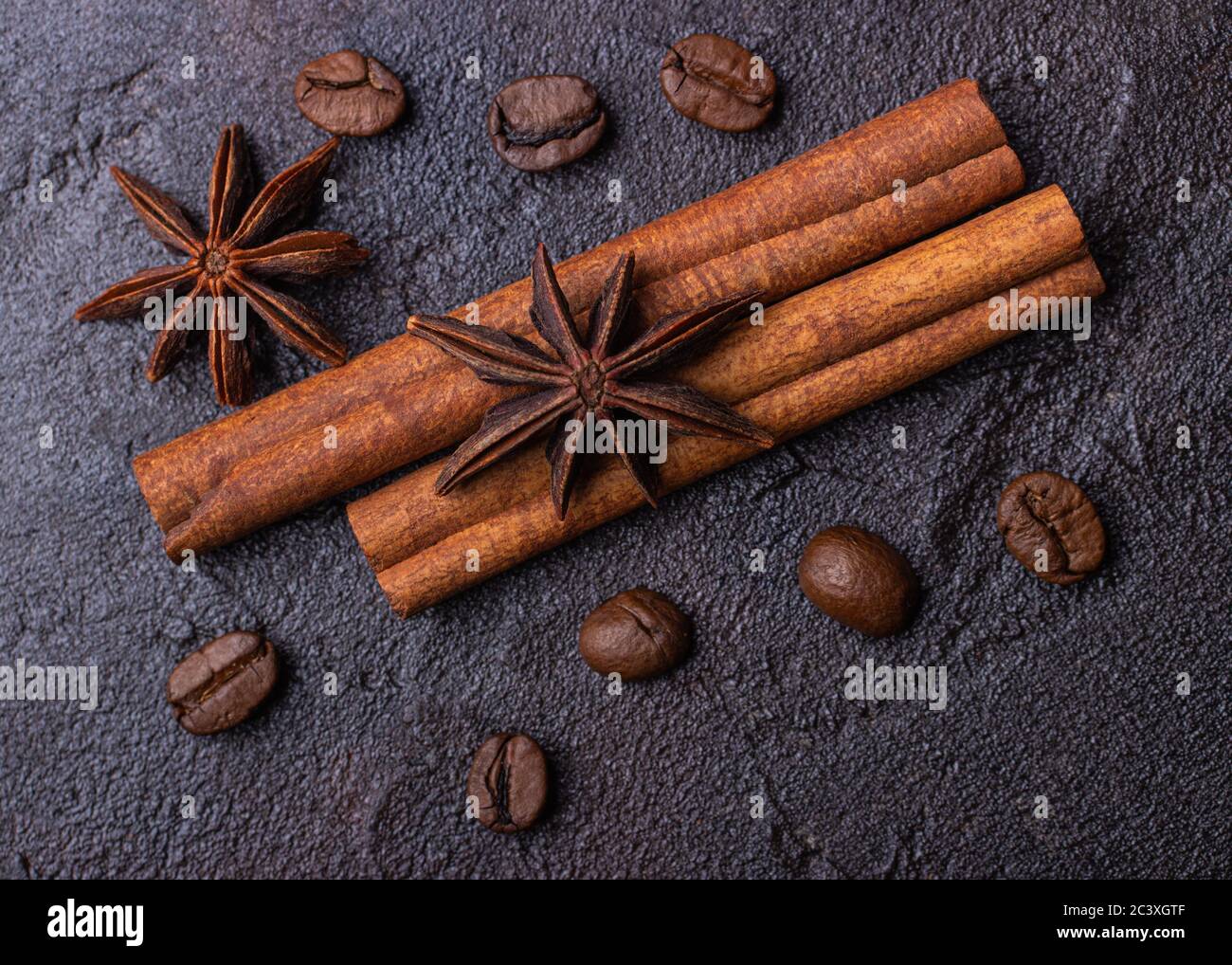 Badyan, cinnamon and coffe grains on a dark concrete background Stock ...