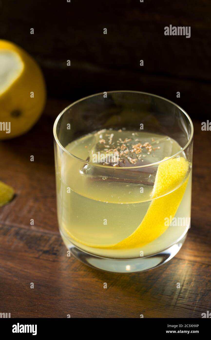 Boozy Clarified English Milk Punch with Ice and Lemon Stock Photo - Alamy