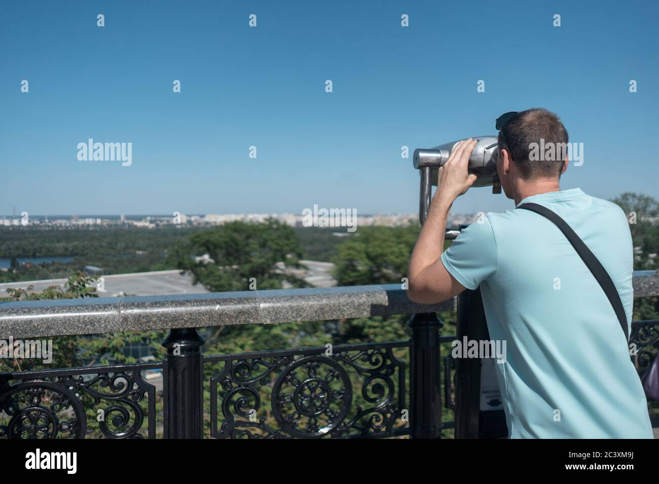 young tourist looking at sightseeing observation binocular Stock Photo ...