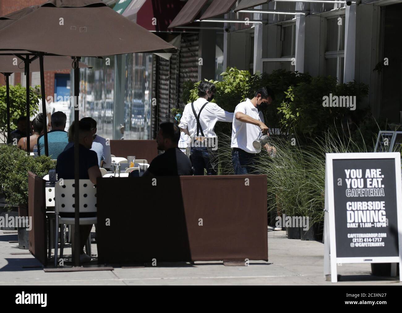New York, United States. 22nd June, 2020. A restaurant serves lunch ...