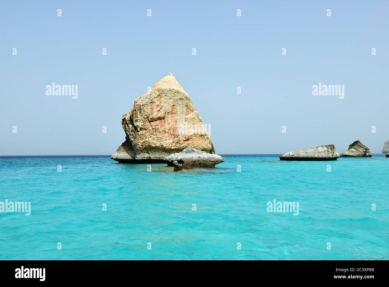 Cliffs above azure water of the Arabian Sea nearby Ras Shuab, Shuab Bay ...