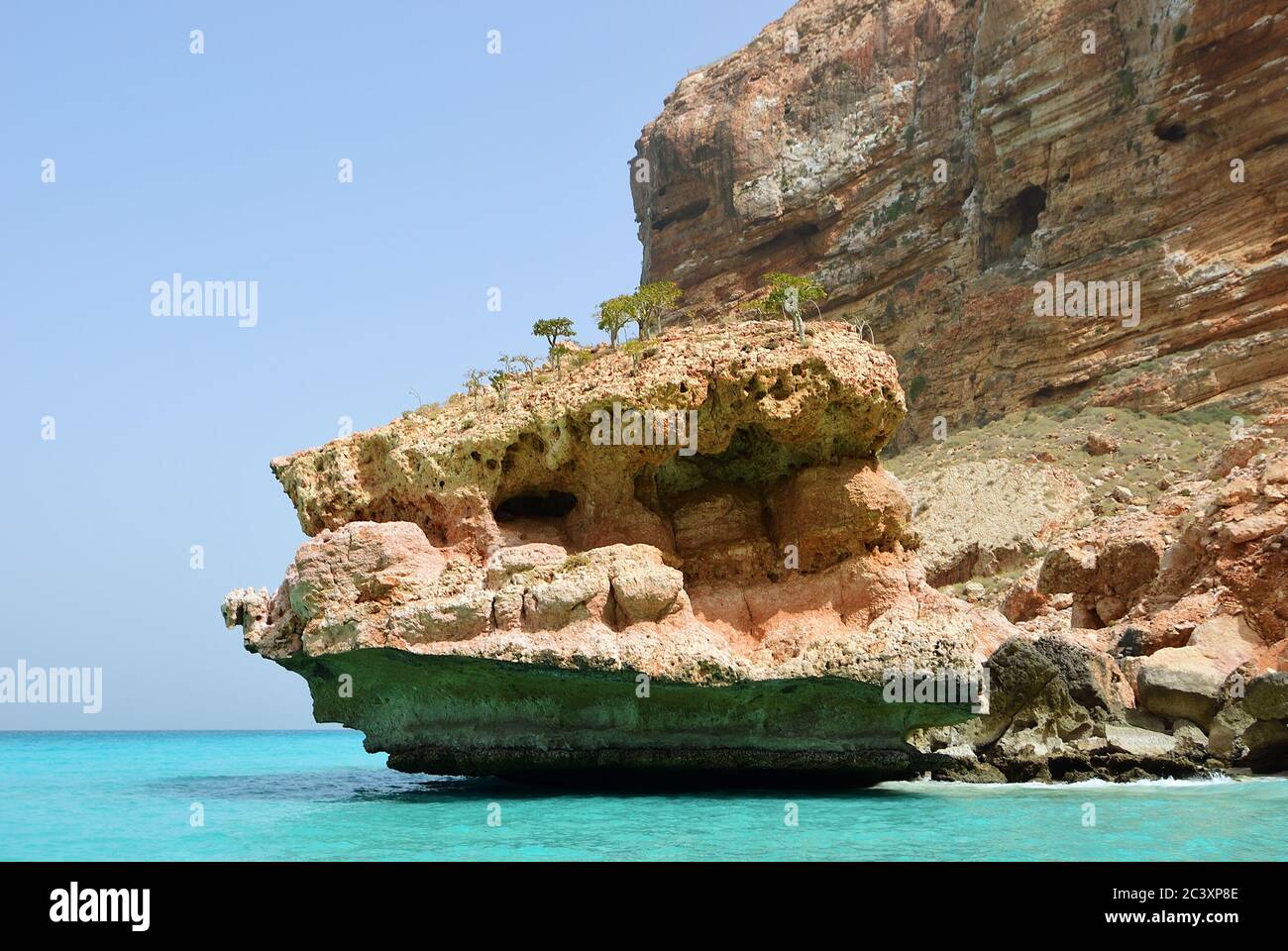 Cliffs above azure water of the Arabian Sea nearby Ras Shuab, Shuab Bay ...