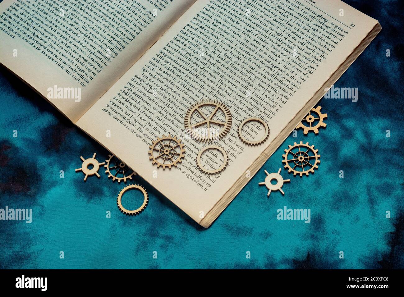 wooden-cogwheels-on-a-page-of-a-book-industry-concept-information