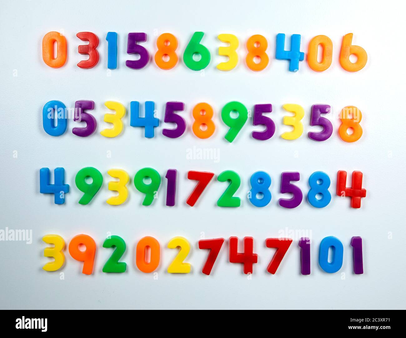 magnetic numbers on white background Stock Photo - Alamy