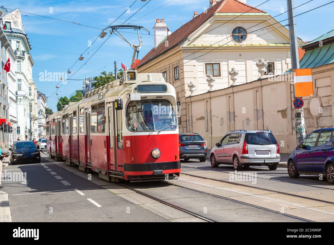 Traditional red electric tram in Vienna, Austria in a beautiful summer ...