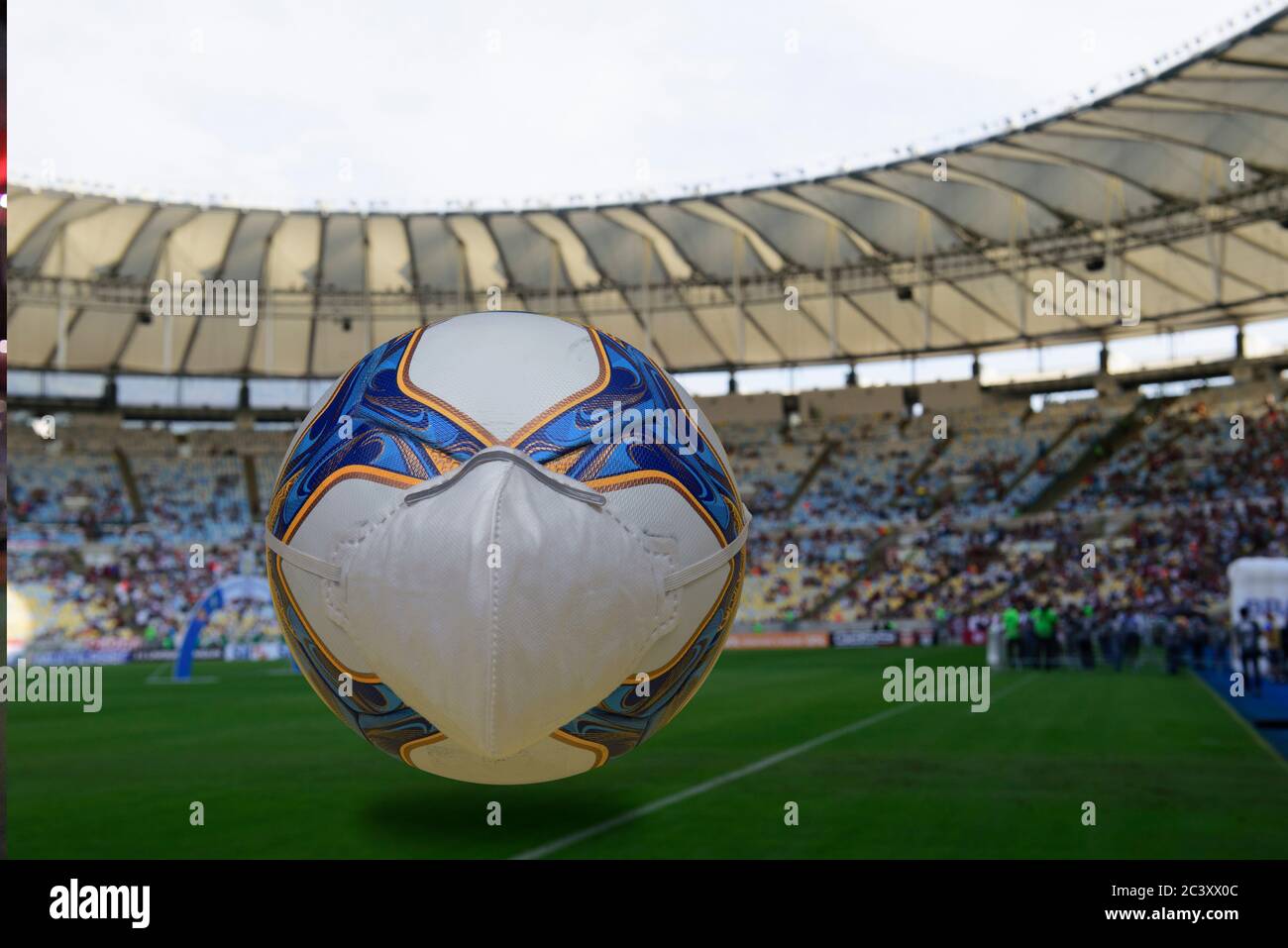 ball with mask to represent the return of football after the pandemic ...