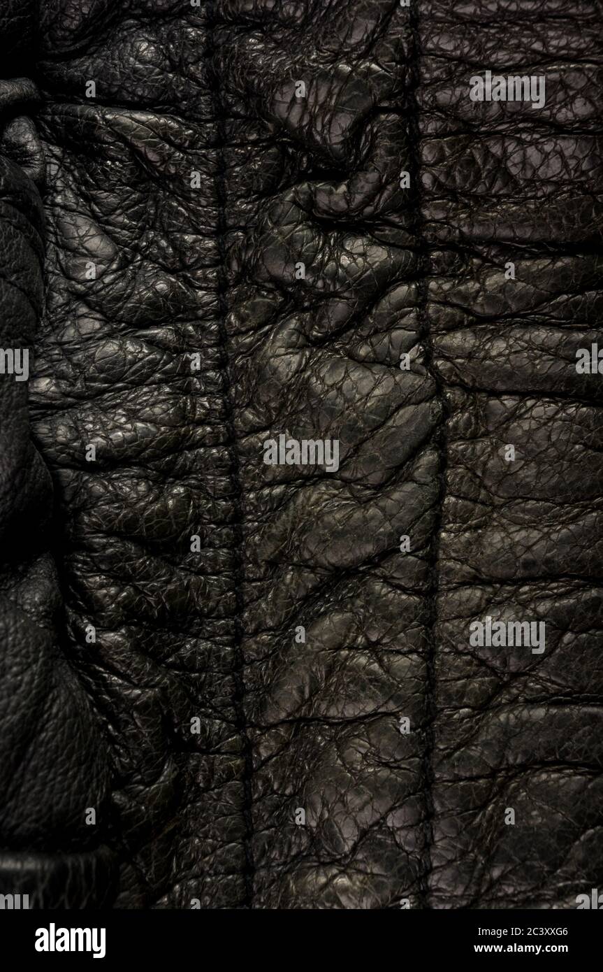 Old vintage genuine soft black leather texture background, top layer ...
