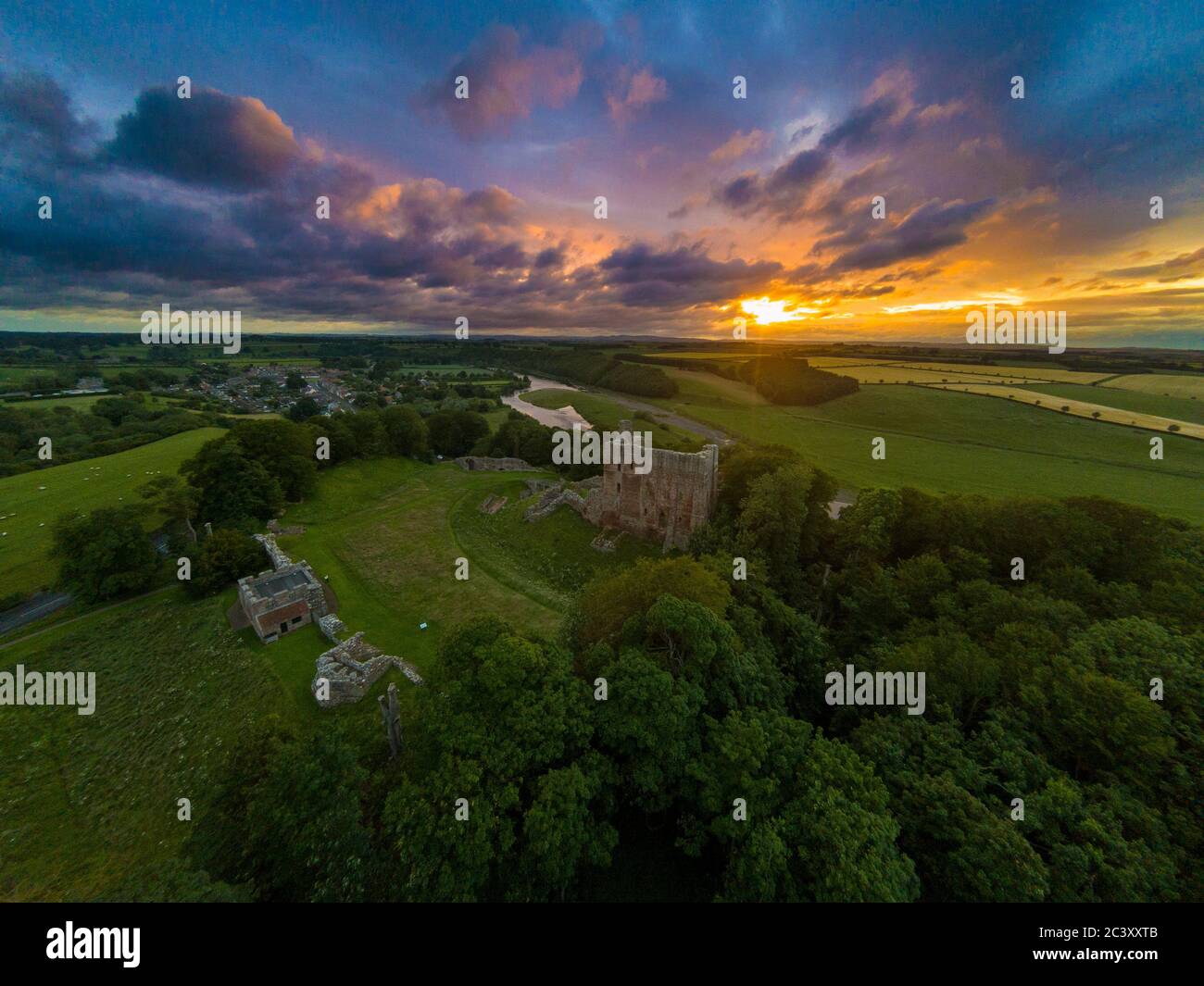 Norham Castle built in 1121 by the Bishops of Durham sits high above ...