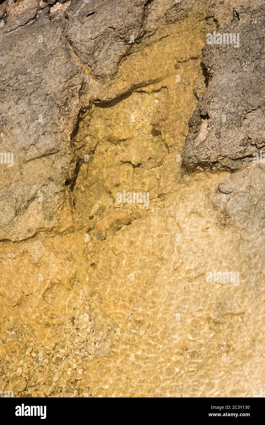 Rocky texture in caribbean beach Stock Photo - Alamy