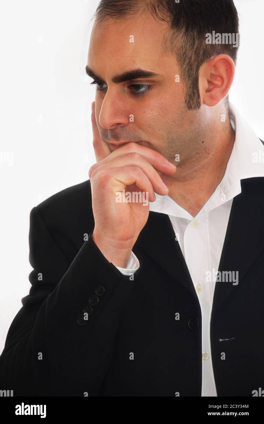 Smart business man thinking on a white background Stock Photo - Alamy