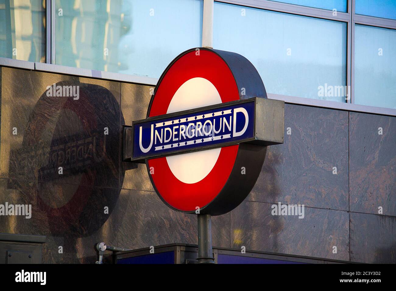 London underground sign attached to a building Stock Photo - Alamy