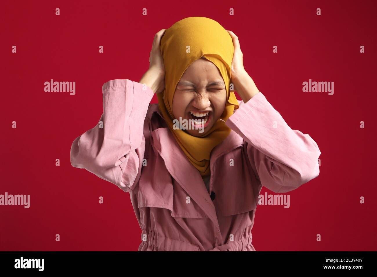 Asian muslim teenage girl wearing hijab, screaming losing temper, cant ...
