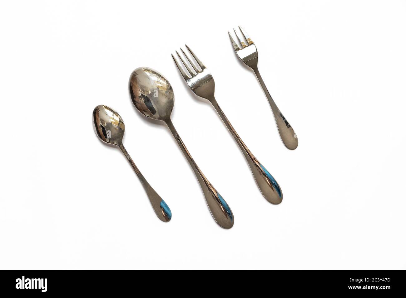 Two forks and two spoons group isolated over white Stock Photo - Alamy
