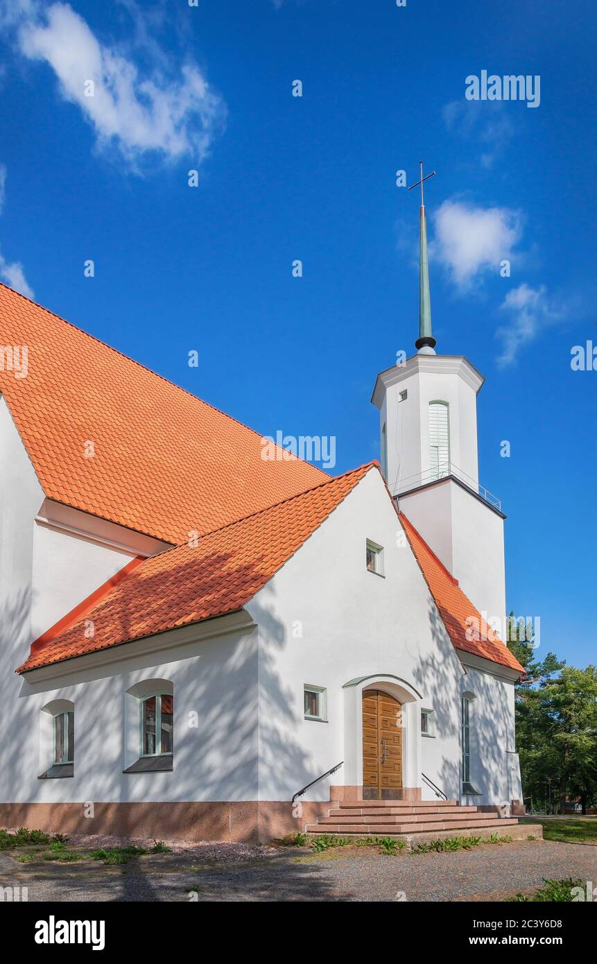 Entrance of a beautiful white Lutheran church in rural Finland. Bright ...