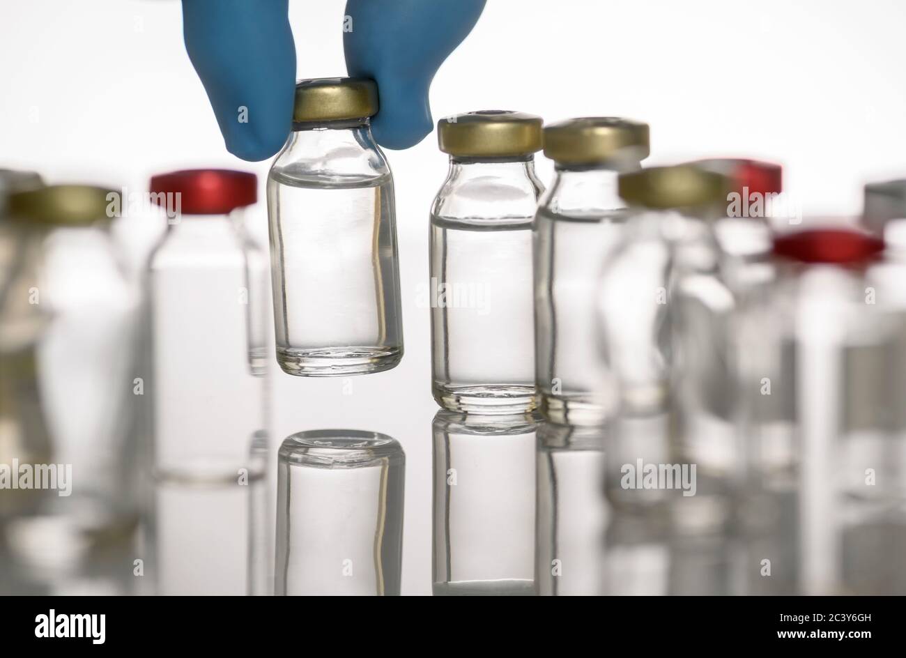 Person holding vial studio hi-res stock photography and images - Alamy