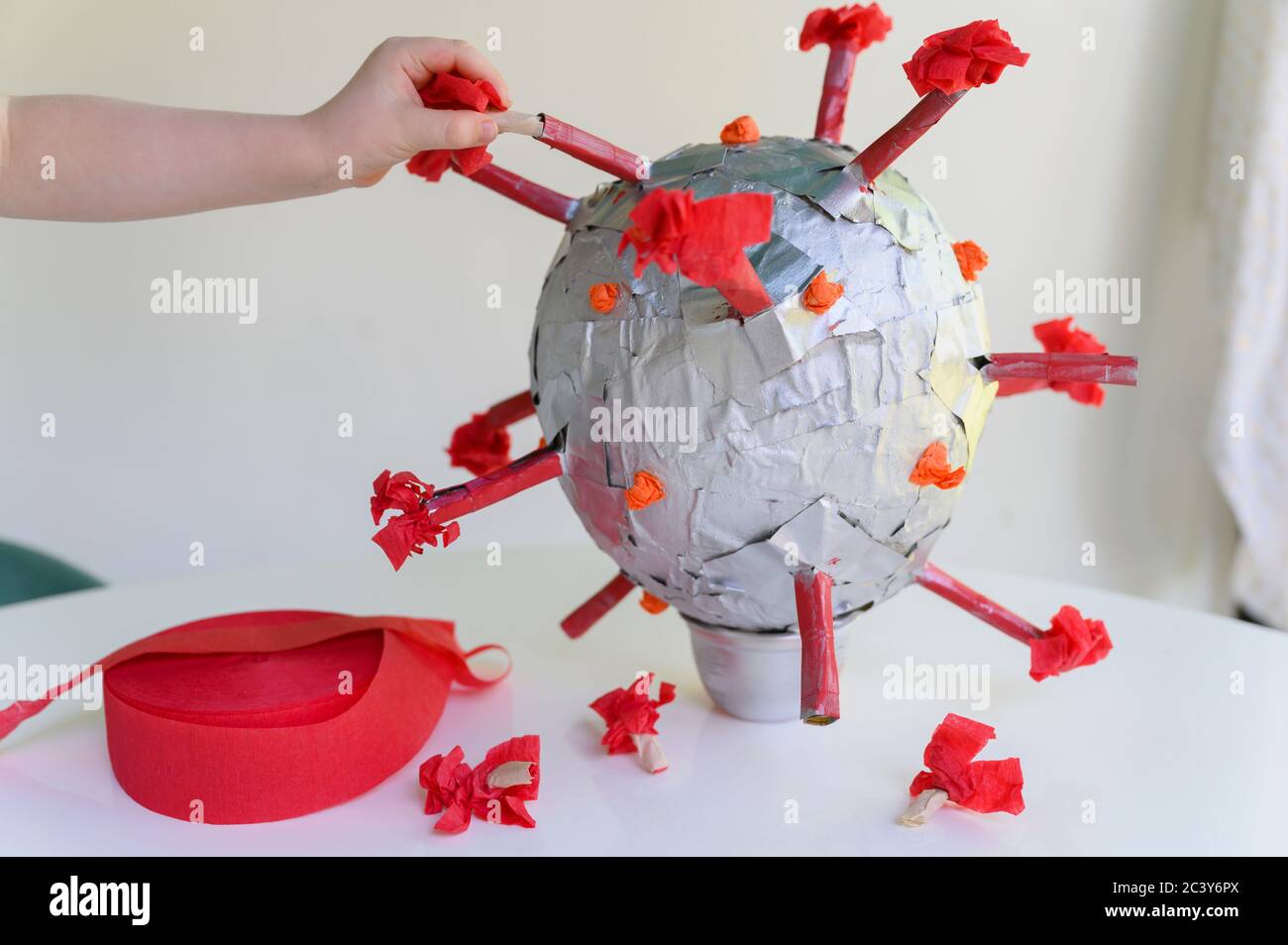 Girl (6-7) making papier mache model of coronavirus Stock Photo - Alamy