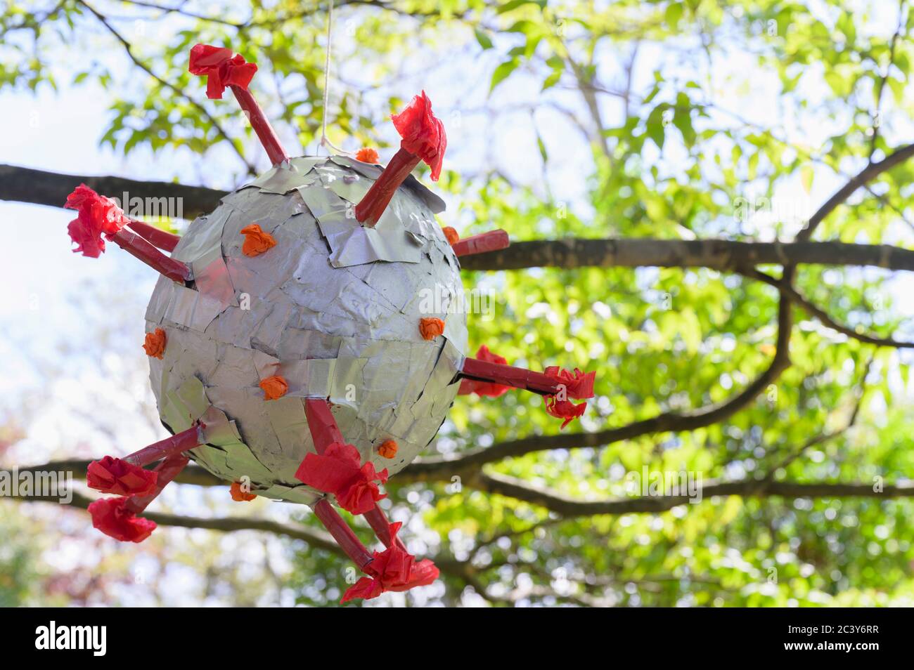 Pinata hanging from tree hi-res stock photography and images - Alamy