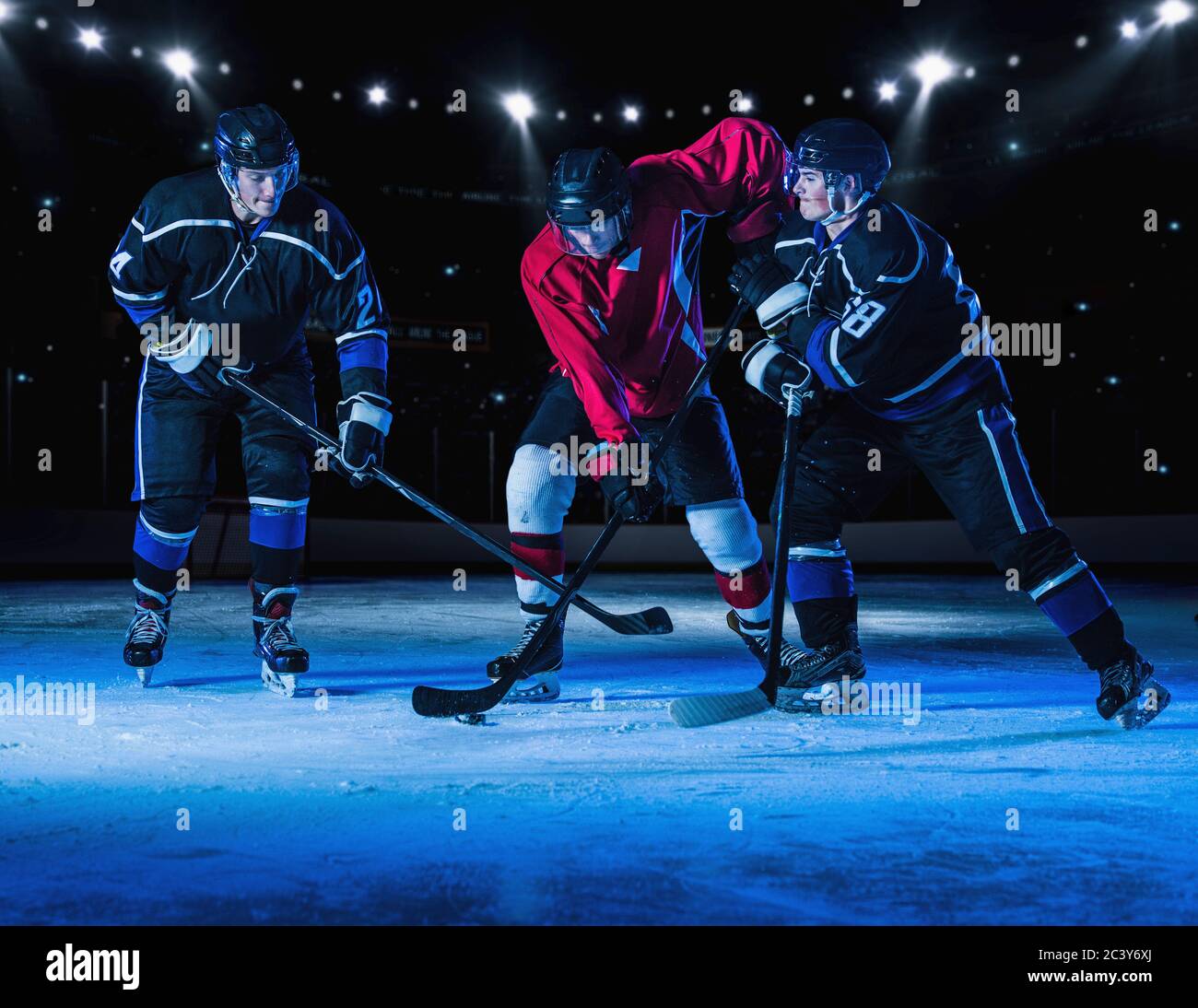 Hockey players fighting for puck Stock Photo - Alamy